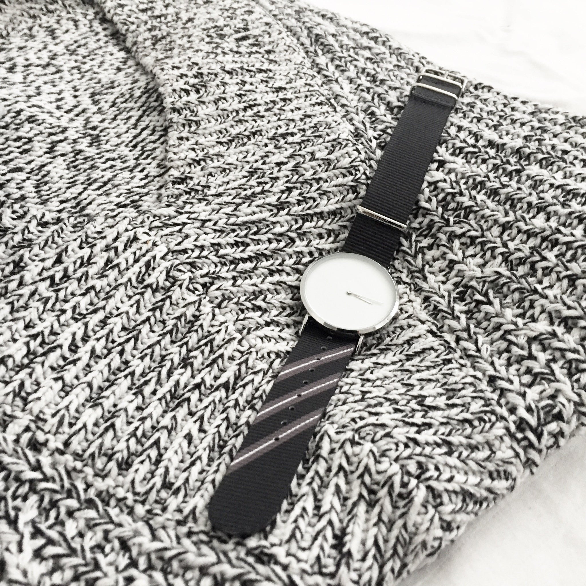 Black Razor Strap on Black and White Sweater